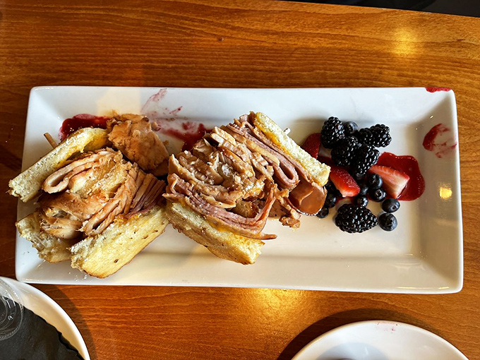 Breakfast gets the royal treatment with this Monte Cristo sandwich, where layers of savory goodness meet fresh berries in a morning romance worth waking up for.