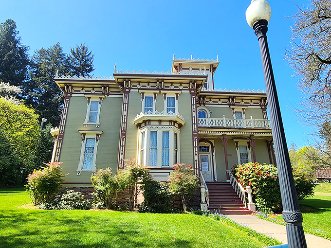 The Moyer House stands as Victorian elegance personified, its mint-green facade and ornate details whispering stories of Oregon's more genteel past.