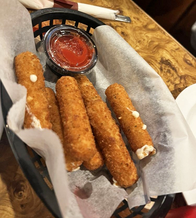 Golden-brown, perfectly crisp on the outside, molten cheese heaven within. These aren't just mozzarella sticks; they're edible magic wands.