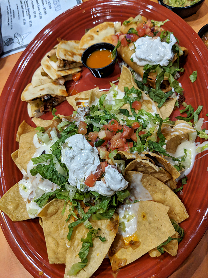 Nacho architecture at its finest! These aren't just chips with toppings&mdash;they're a masterclass in proper distribution of cheese, sour cream, and fresh veggies.