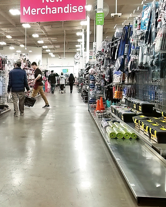 Under the "New Merchandise" sign, shoppers navigate aisles like explorers in an urban jungle. Every turn promises unexpected discoveries.