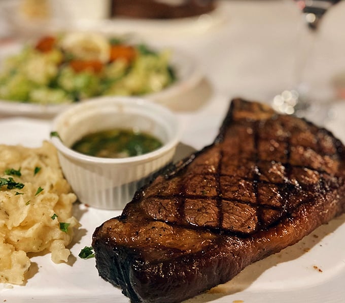 Behold the star attraction: a perfectly seared New York Strip with textbook crosshatch marks. That crust contains more flavor than some restaurants' entire menus.