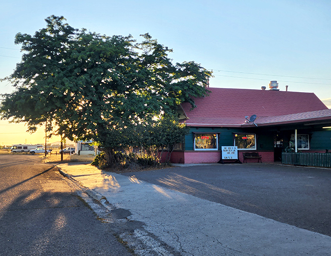 Sunset casts a warm glow on this local eatery, where the tree provides more shade than most parking garages in Los Angeles. Small-town dining at its most authentic.