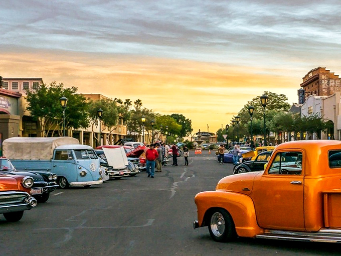 Classic cars line Main Street during one of Yuma's frequent downtown events. Nothing says "affordable retirement" like having time to polish chrome under perfect evening skies.