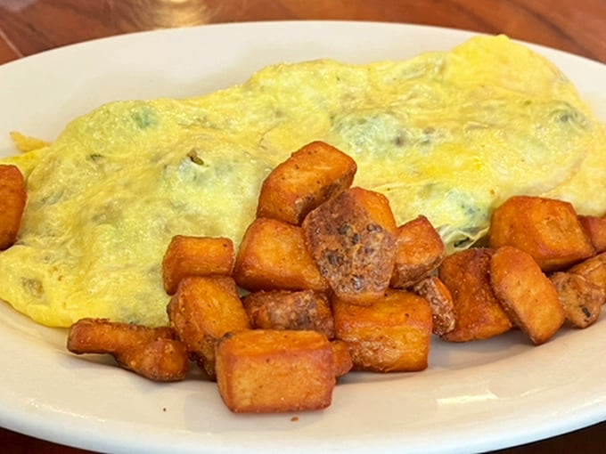 A perfect omelet shouldn't be complicated&mdash;just fluffy eggs embracing their fillings alongside home fries that strike the ideal balance between crispy exterior and tender interior.
