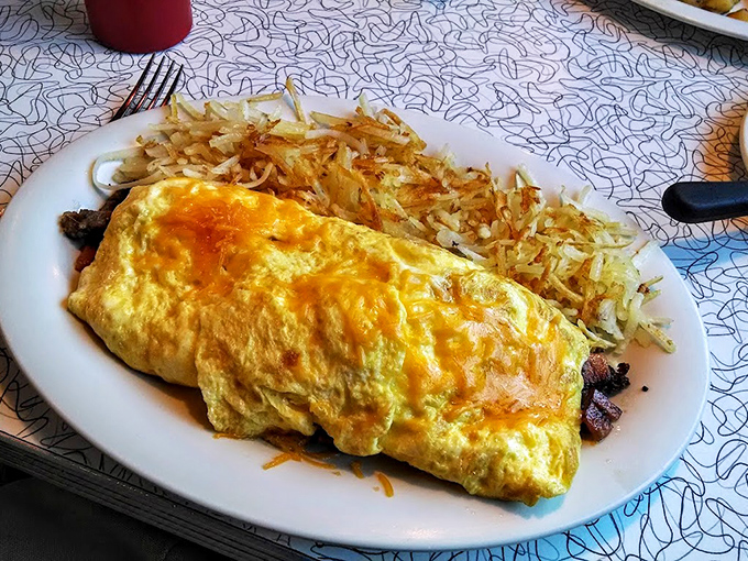 This omelet performs the perfect balancing act&mdash;fluffy eggs outside, savory fillings inside, with hash browns that demand respect.