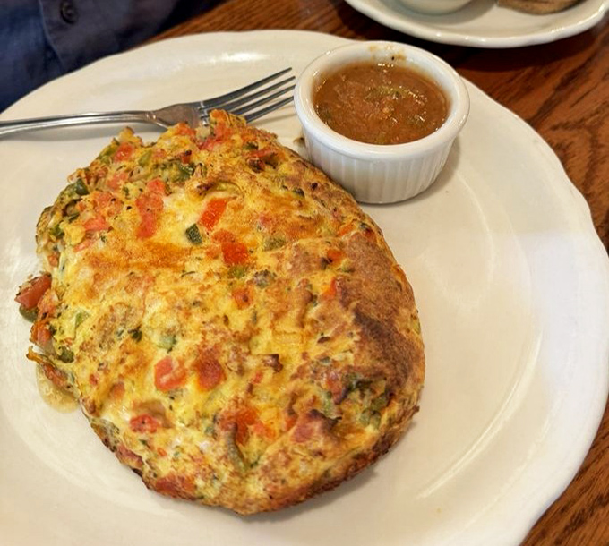 Not so much an omelet as an egg masterpiece &ndash; golden, puffy, and substantial enough to make you wonder if you'll need dinner later.