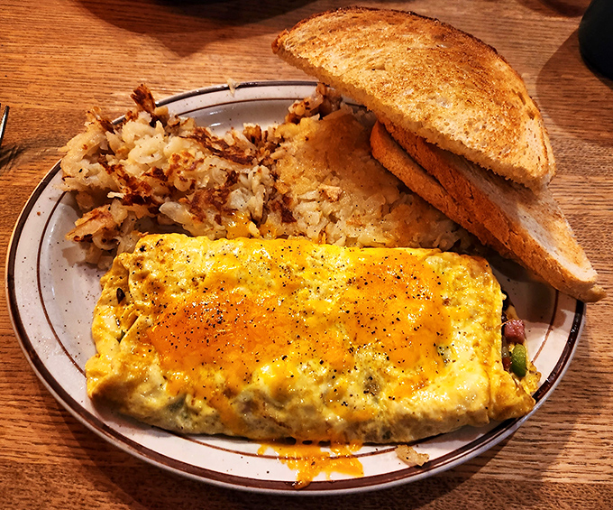 This isn't just an omelet; it's a golden envelope delivering a personal letter of happiness directly to your taste buds.