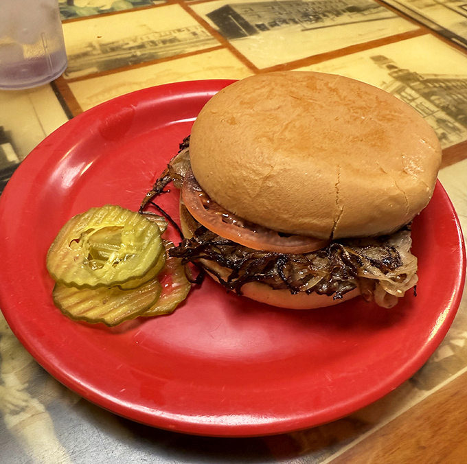 Behold the legendary onion burger in its natural habitat &ndash; a symphony of beef and caramelized onions that makes you wonder why all burgers aren't made this way.