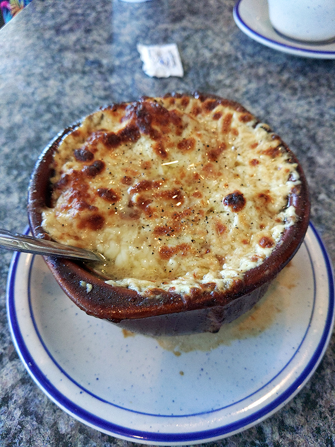 Behold the star attraction – French onion soup with a cheese cap so perfectly broiled it deserves its own standing ovation.