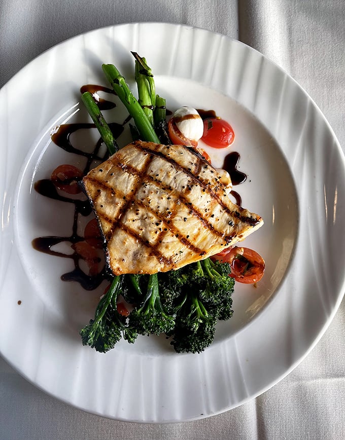 Orange ginger black cod arrives looking like edible art, proving that beautiful plating and serious flavor can absolutely coexist peacefully.