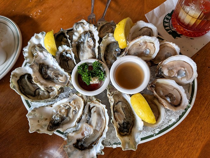 These oysters aren't just served; they're presented &ndash; plump treasures nestled on ice, waiting for a squeeze of lemon and that perfect moment of briny bliss.