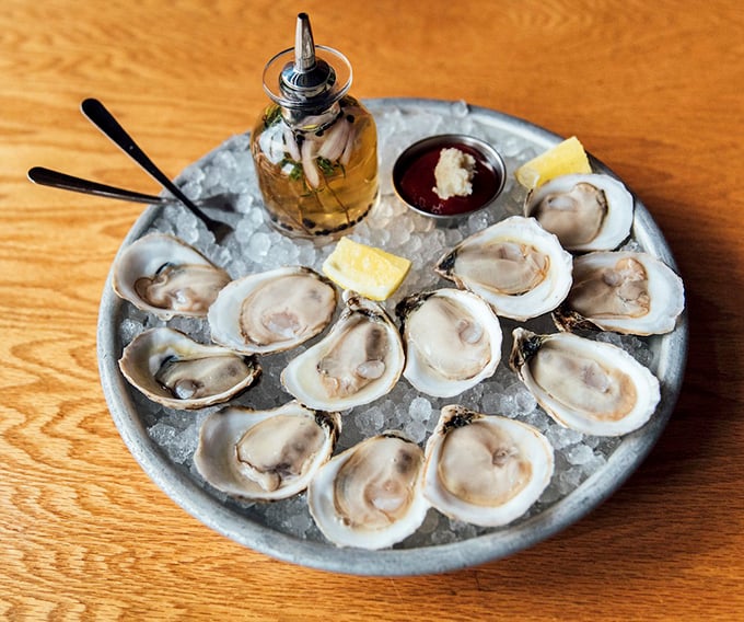 These glistening beauties arrive on a bed of ice like precious jewels, accompanied by their perfect partners: mignonette, horseradish, and lemon.