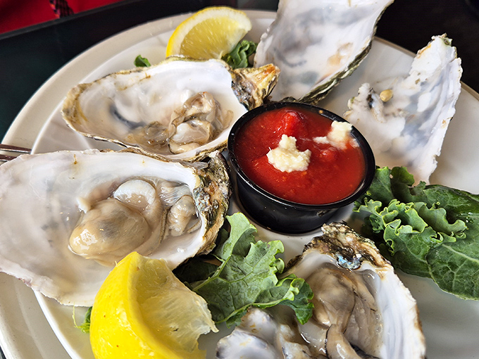 These oysters aren't just served; they're presented like the coastal jewels they are &ndash; briny, plump, and practically whispering tales of the Pacific.