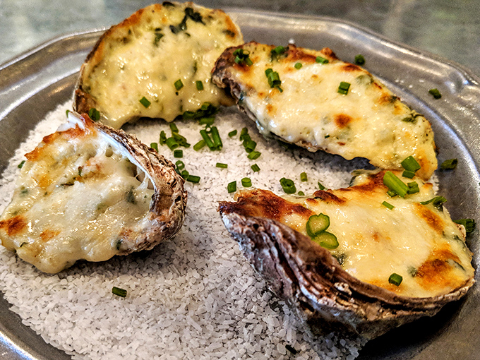 These Oysters Rockefeller aren't just baked&mdash;they're transformed. Spinach bechamel and parmesan create a decadent blanket for these briny treasures.
