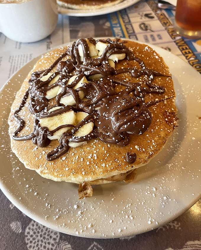 This pancake doesn't just have toppings&mdash;it's having a full-blown chocolate and banana party that your taste buds are definitely invited to.