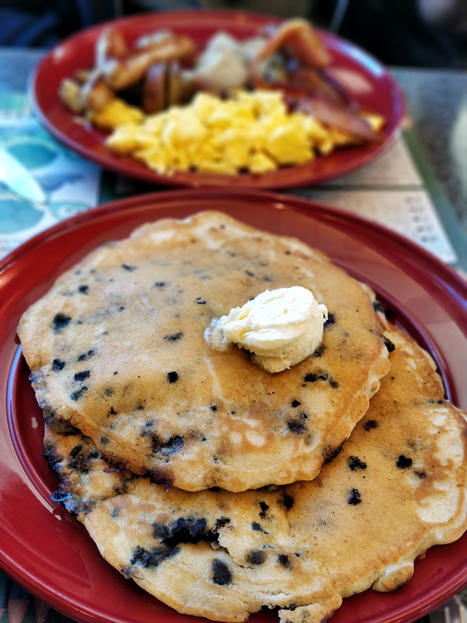 Blueberry pancakes that make you question why anyone bothers with fancy brunch. Those berries aren't just added&mdash;they're strategically deployed for maximum flavor impact.