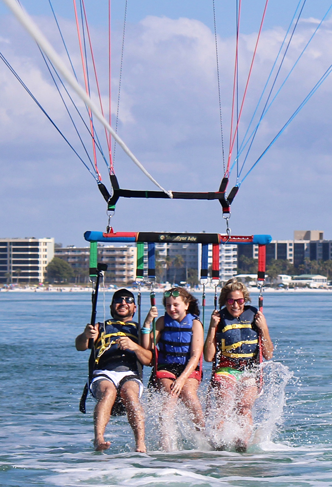 I'm flying, Jack! Parasailing offers the bird's-eye view of Siesta Key that postcards can only dream of capturing.