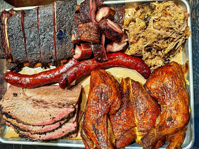 The barbecue equivalent of a greatest hits album—brisket, ribs, sausage, chicken, and pulled pork sharing one glorious tray.