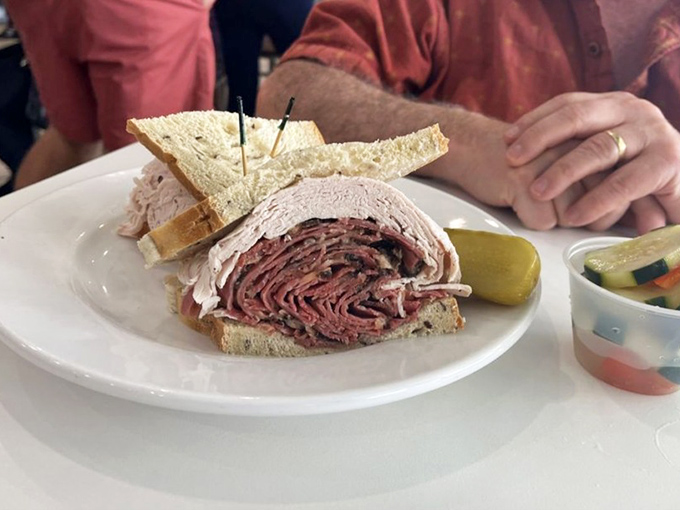 Behold the star attraction: layers of hand-sliced pastrami stacked with such generosity, you'll need to unhinge your jaw like a python.
