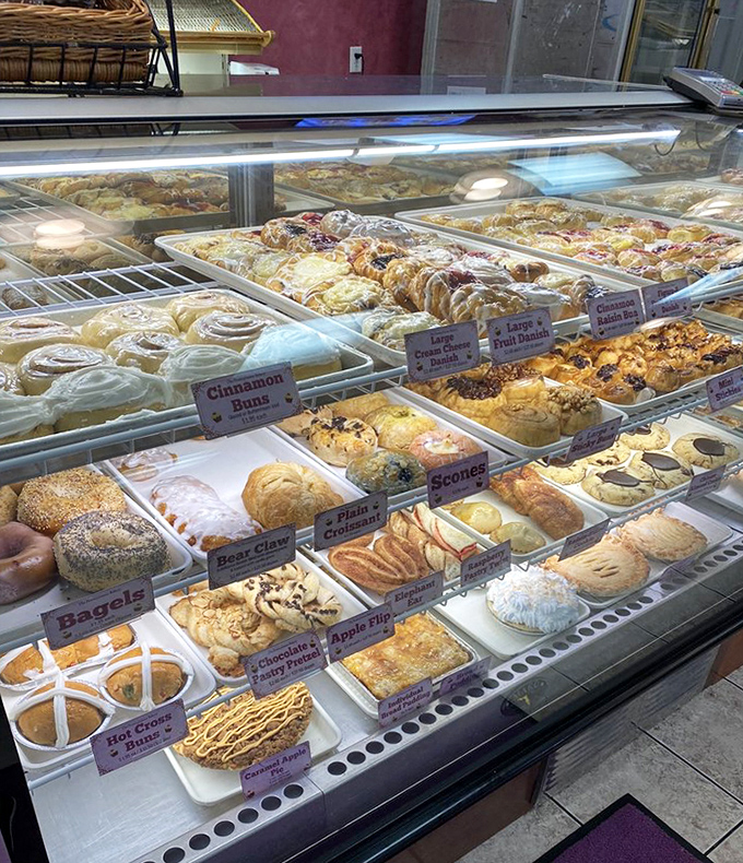 Pastry paradise awaits! This display case isn't just showing food—it's exhibiting edible art that makes choosing just one item mathematically impossible.