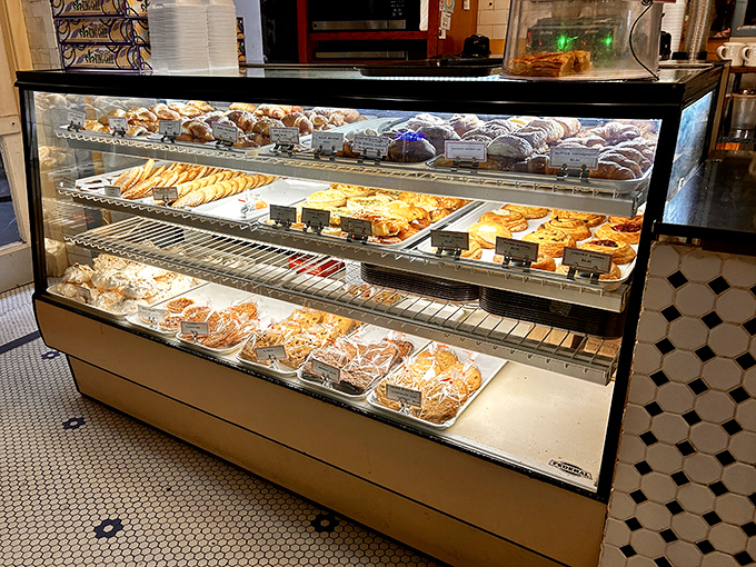 This pastry case is basically the Louvre, except you're allowed to eat the art and nobody judges you for it.