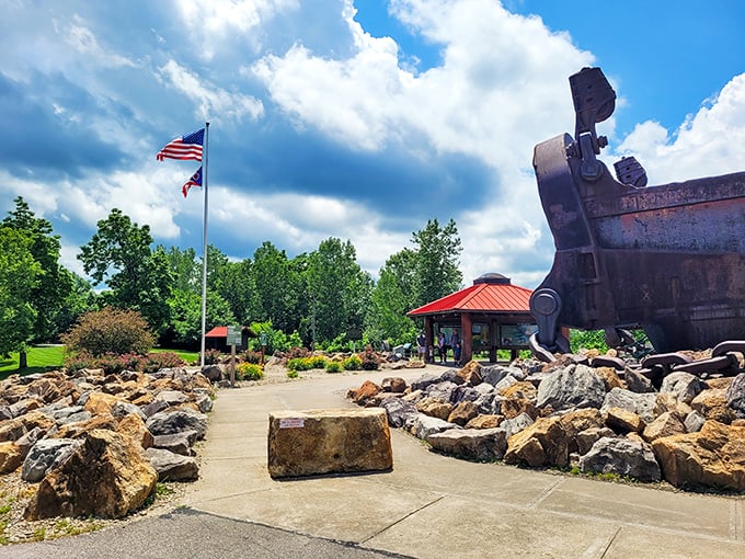 The pathway to industrial history is lined with stones once moved by the very machine they now commemorate. Poetry in rust and rock.