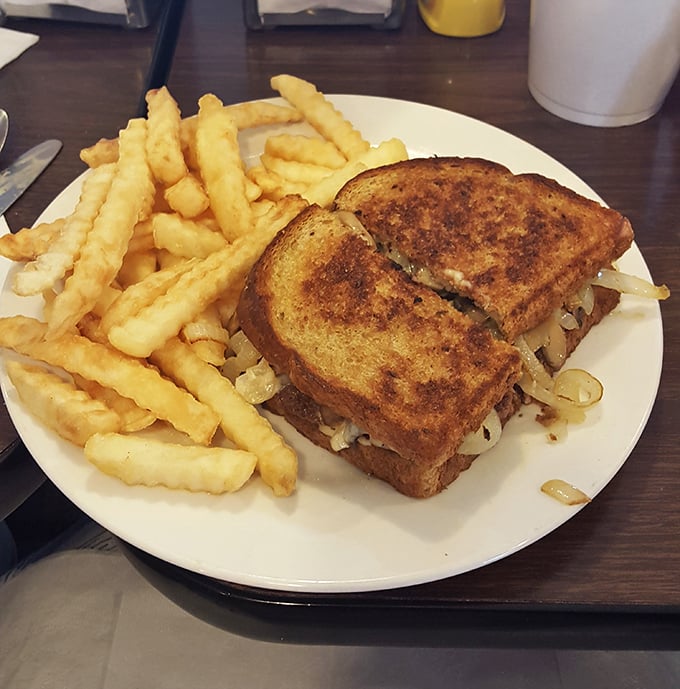 The legendary patty melt in all its glory&mdash;perfectly grilled rye bread embracing melted cheese and caramelized onions in a sandwich that deserves its own hall of fame.