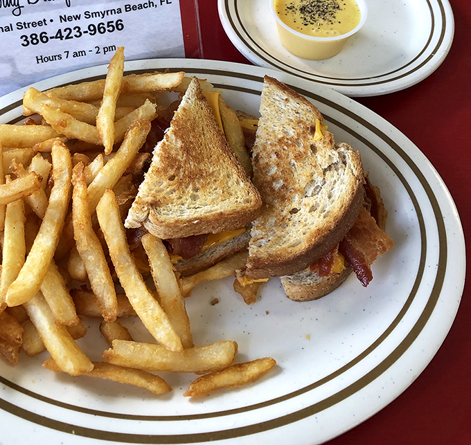 The patty melt&mdash;that perfect marriage of beef, cheese, and toasted rye&mdash;arrives with fries so golden they deserve their own Florida sunshine tax.