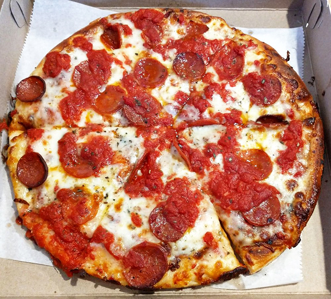 Pizza poetry in a box: those curled pepperoni cups collecting pools of savory oil are what dreams are made of.