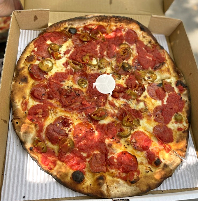 Pizza perfection doesn't need fancy words &ndash; just look at that char on the crust and those jalape&ntilde;os playing hide-and-seek with the pepperoni.