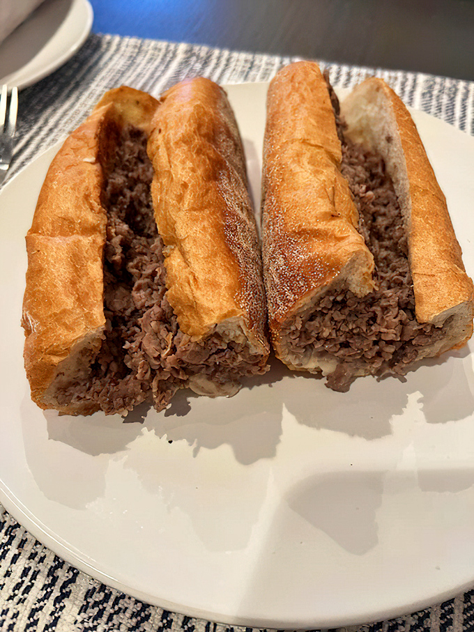 Behold the star of the show: thinly sliced ribeye nestled in a perfect roll. This isn't just a sandwich; it's Philadelphia's soul made edible.