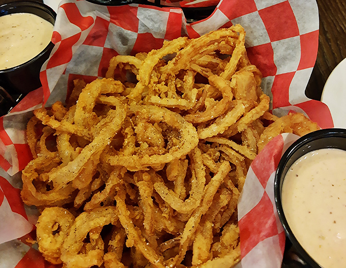 Golden, crispy onion rings that make such a satisfying crunch, you'll want to apologize to your dining companions for the noise &ndash; but they'll be too busy reaching for another to mind.