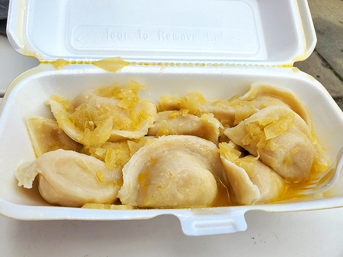Pillowy pierogies swimming in butter and onions—the kind that make you close your eyes and forget your table manners. Resistance is futile.