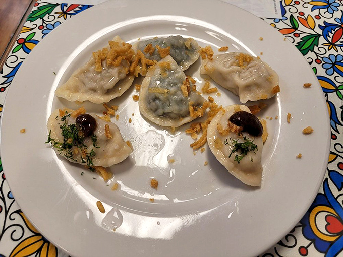 These handmade dumplings are little works of art – delicately crimped edges, perfectly pan-fried, and topped with those magical caramelized onions.