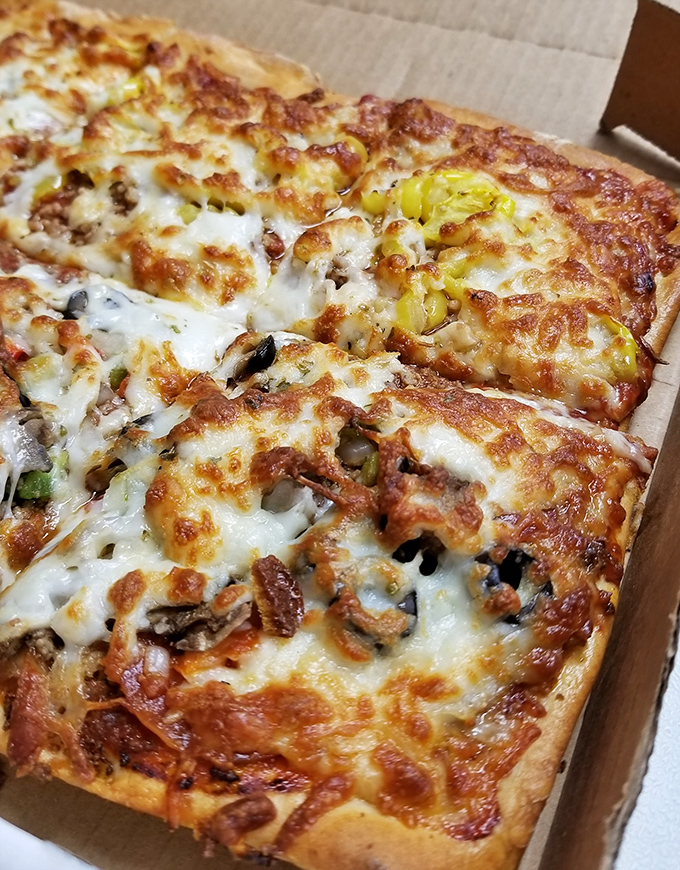 Square slices with golden cheese and perfectly distributed toppings prove geometry class was actually preparing us for pizza appreciation.