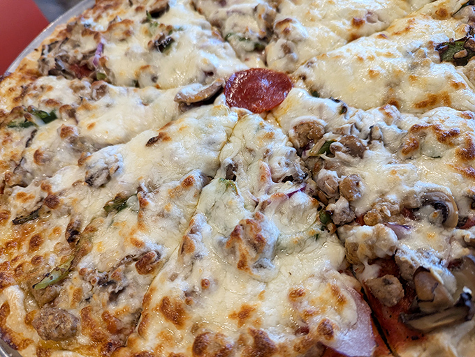 This isn't just pizza&mdash;it's edible artwork where cheese, meat, and mushrooms perform a beautiful dance of flavor on a perfect crust. 