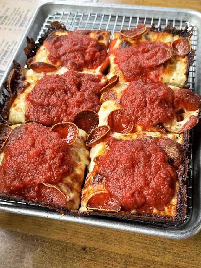 Detroit-style pizza perfection: Those crispy, caramelized edges are the culinary equivalent of finding an extra $20 in your winter coat pocket.