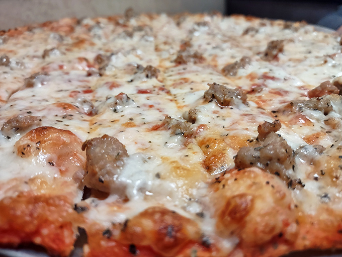 Look at that cheese pull potential! The perfect thin crust supports its toppings like a good friend&mdash;there when you need it but never stealing the spotlight.