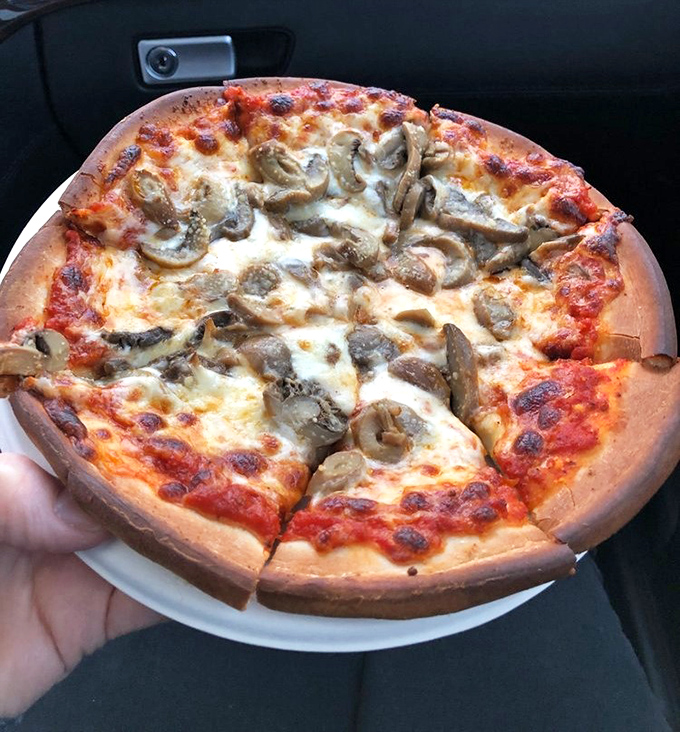 Pizza that doesn't need pretension to be delicious. Those mushrooms aren't trying to impress anyone, yet somehow they've impressed everyone.