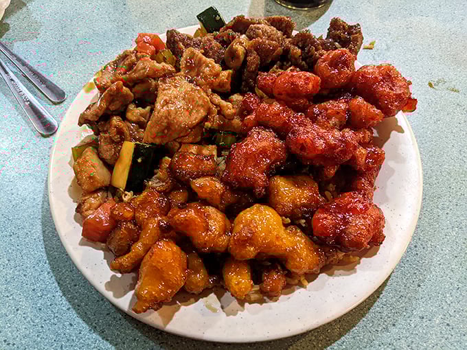 A plate that screams "commitment issues" in the best way possible – why choose one chicken dish when you can have them all?