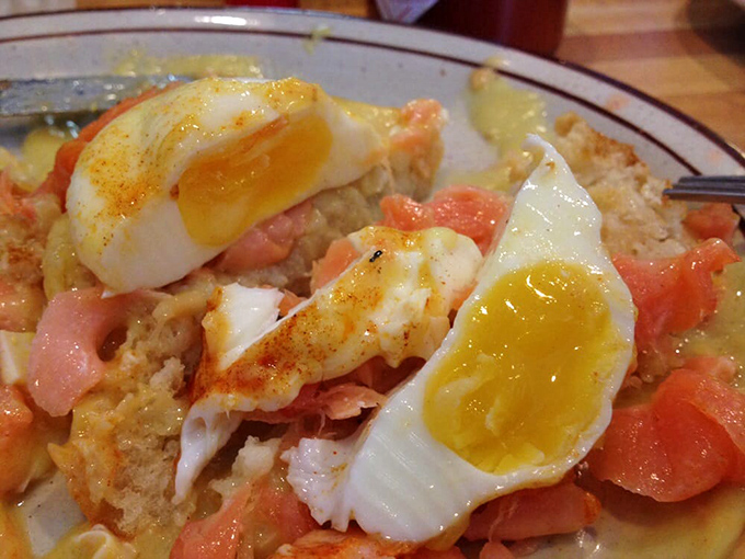 These poached eggs aren't just cooked&mdash;they're pampered to perfection, their golden centers ready to cascade over English muffins like sunrise over the Pacific.