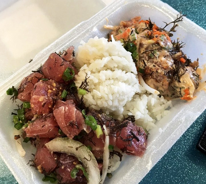 Poke perfection in its natural habitat: glistening cubes of ahi nestled against pearly rice, like edible jewels from Neptune's vault.