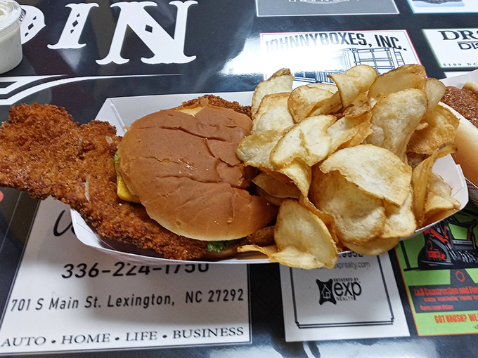 The star of the show: Nick's legendary pork chop sandwich with homemade chips. Crispy, golden perfection that makes you question why you'd eat anything else.