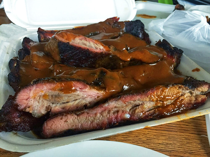 These pork ribs aren't just smoked, they're transformed. That pink smoke ring is the barbecue equivalent of a Michelin star.