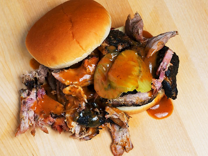 Meet the headliner: Carlile's legendary pork sandwich, where smoke-kissed meat and tangy sauce create a harmony that would make even vegetarians reconsider.