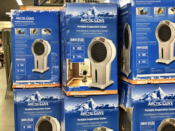 Brand new Arctic Cove coolers stacked like a monument to Arizona summer survival. In the desert, finding these unused at thrift prices feels like striking gold.