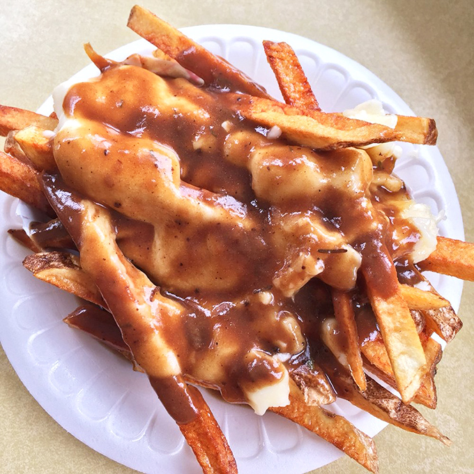 Poutine perfection: Golden fries swimming in gravy with cheese curds melting just enough to make you forget about your diet until tomorrow.