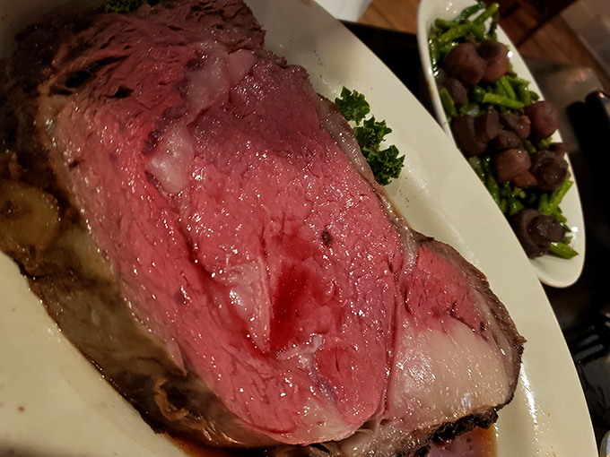 Behold the star of the show: prime rib so perfectly pink and tender, it practically dissolves on your fork before reaching your mouth.