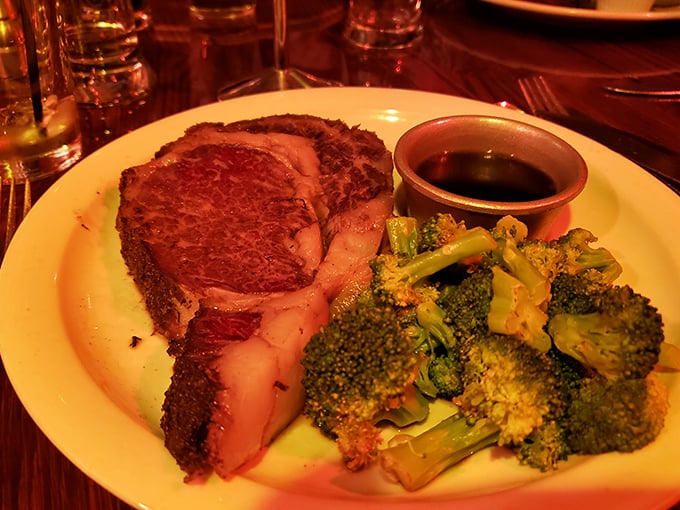 A perfectly crusted prime rib alongside vibrant broccoli&mdash;proof that vegetables can have purpose when escorting the real star to your table.